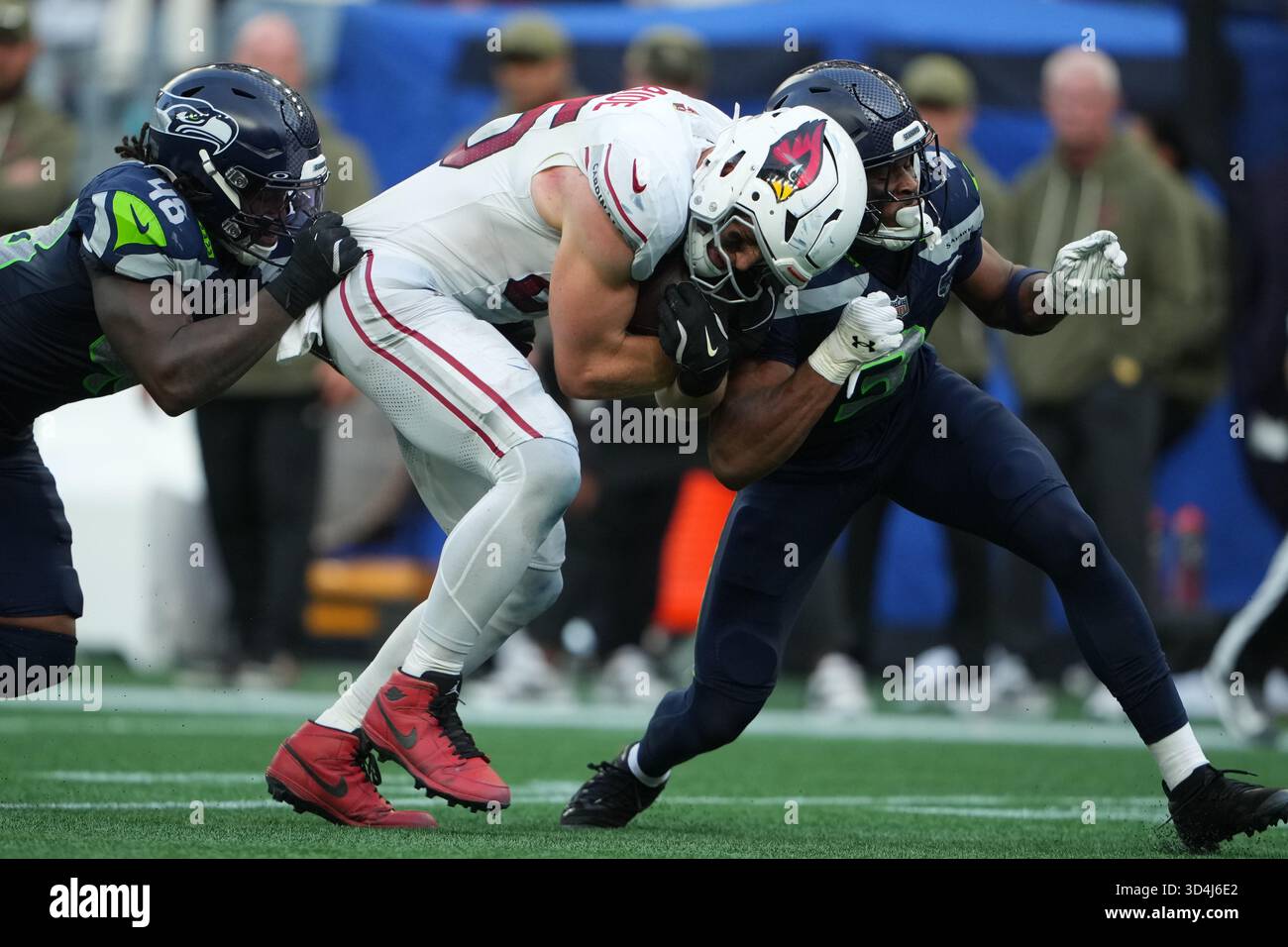 Arizona Cardinals tight end Trey McBride (85) is tackled by Seattle ...
