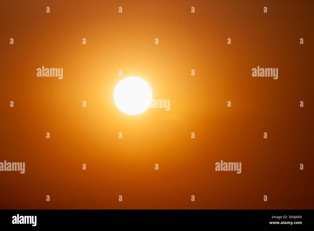 sun, at sunrise or a sunset haze orange light in the sky. The sun is a ...
