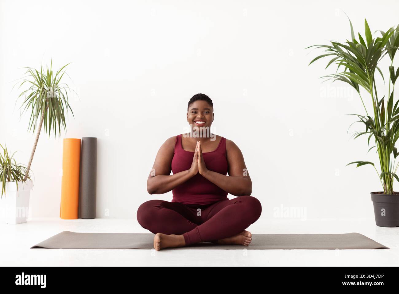 Beautiful Plus Size Black Woman Practices Yoga in Studio, Smiling and ...