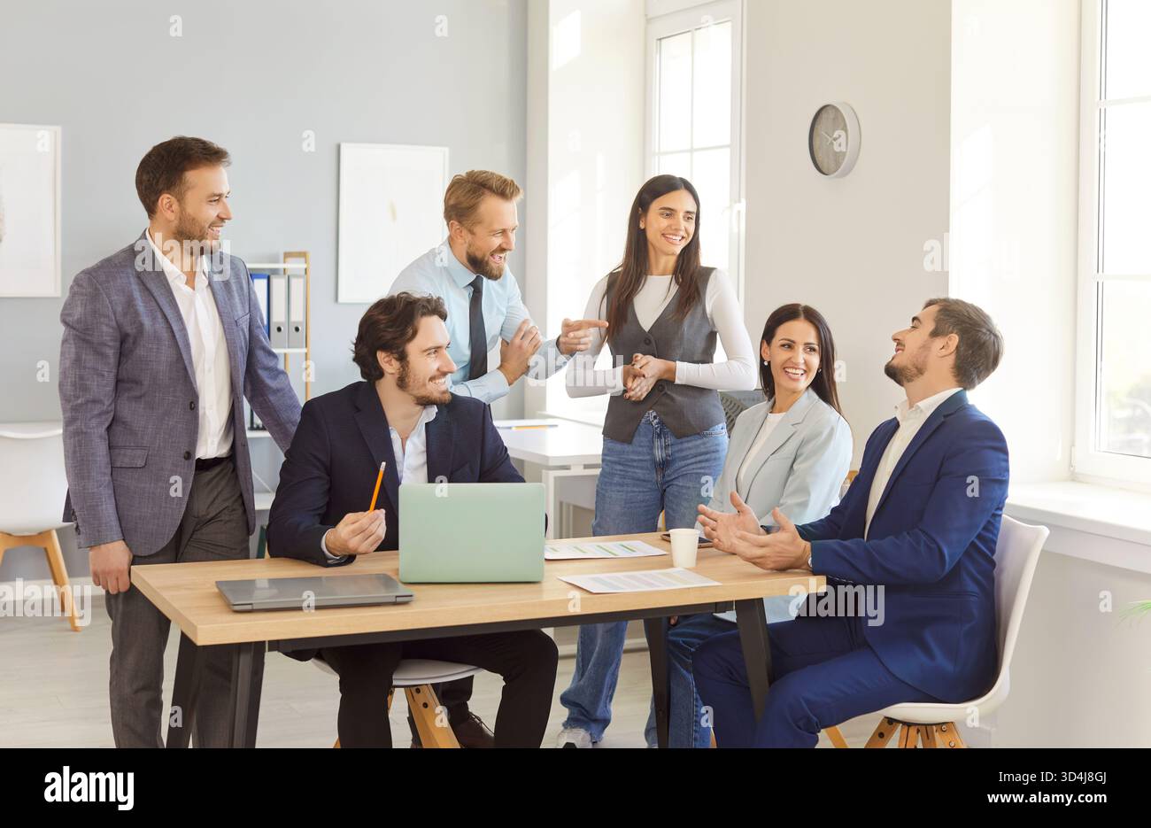 Business Team Collaborating During A Briefing In An Office Environment ...