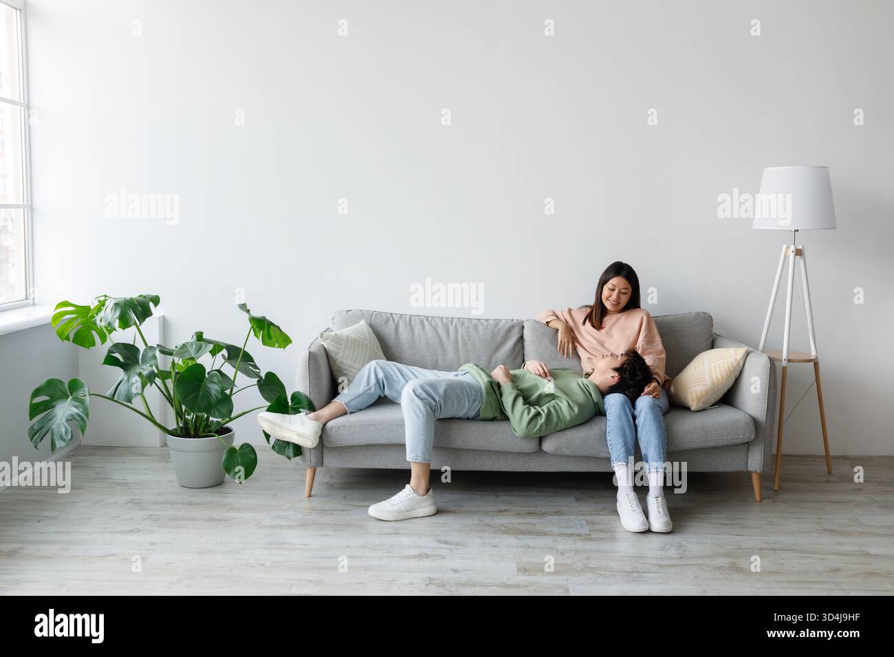 Happy Young Couple Enjoys Relaxing Weekend Time Together at Home on the ...