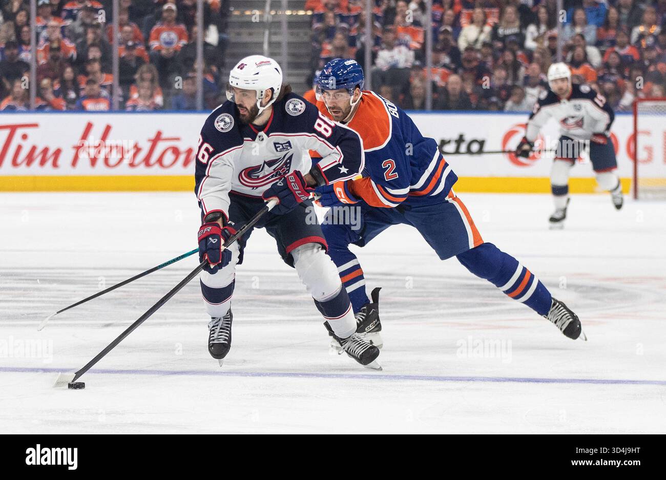 Columbus Blue Jackets' Kirill Marchenko (86) is chased by Edmonton ...