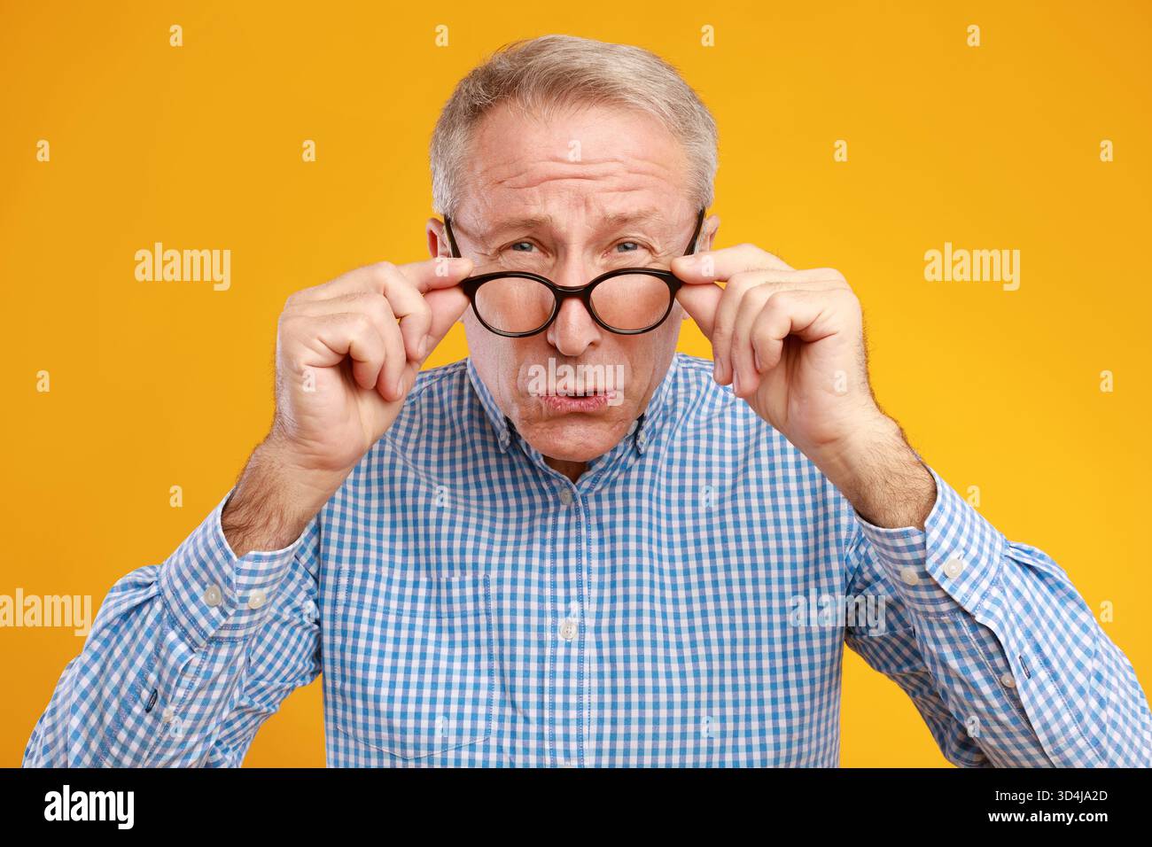 Senior Man Squinting and Struggling With Vision While Wearing ...
