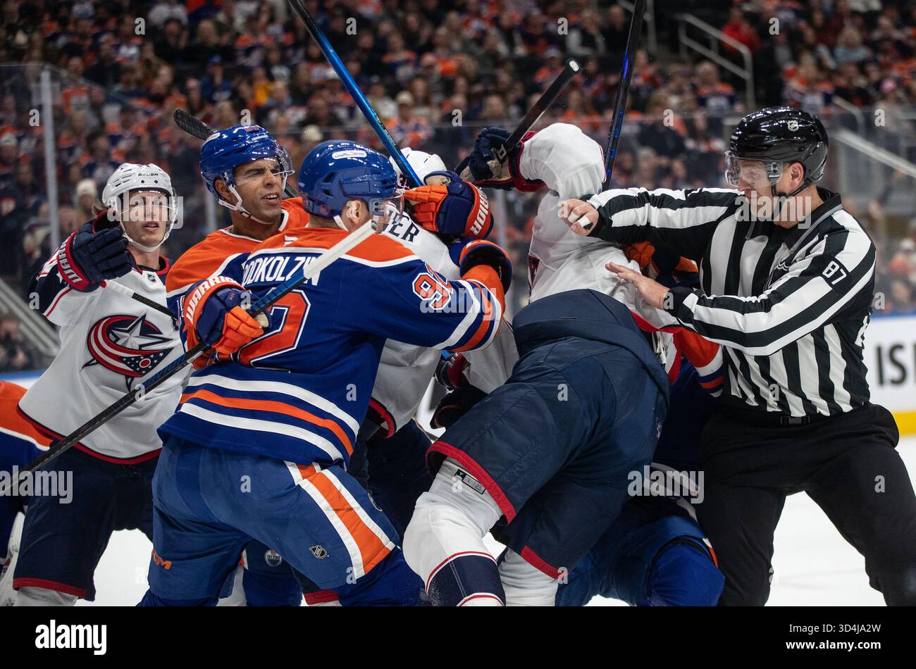 Players from the Columbus Blue Jackets and the Edmonton Oilers fight ...