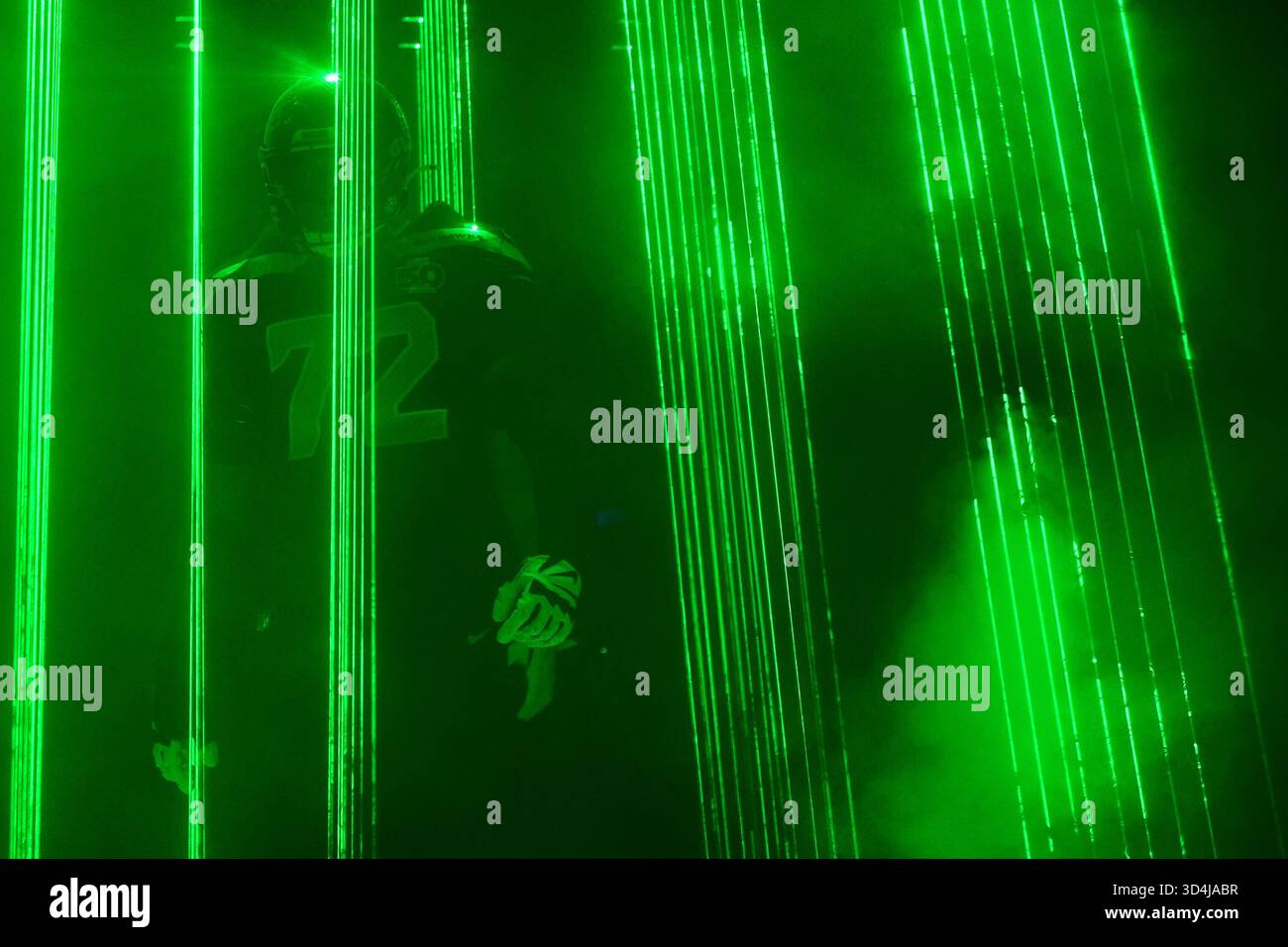 Seattle Seahawks offensive tackle Abraham Lucas walks through lasers in ...