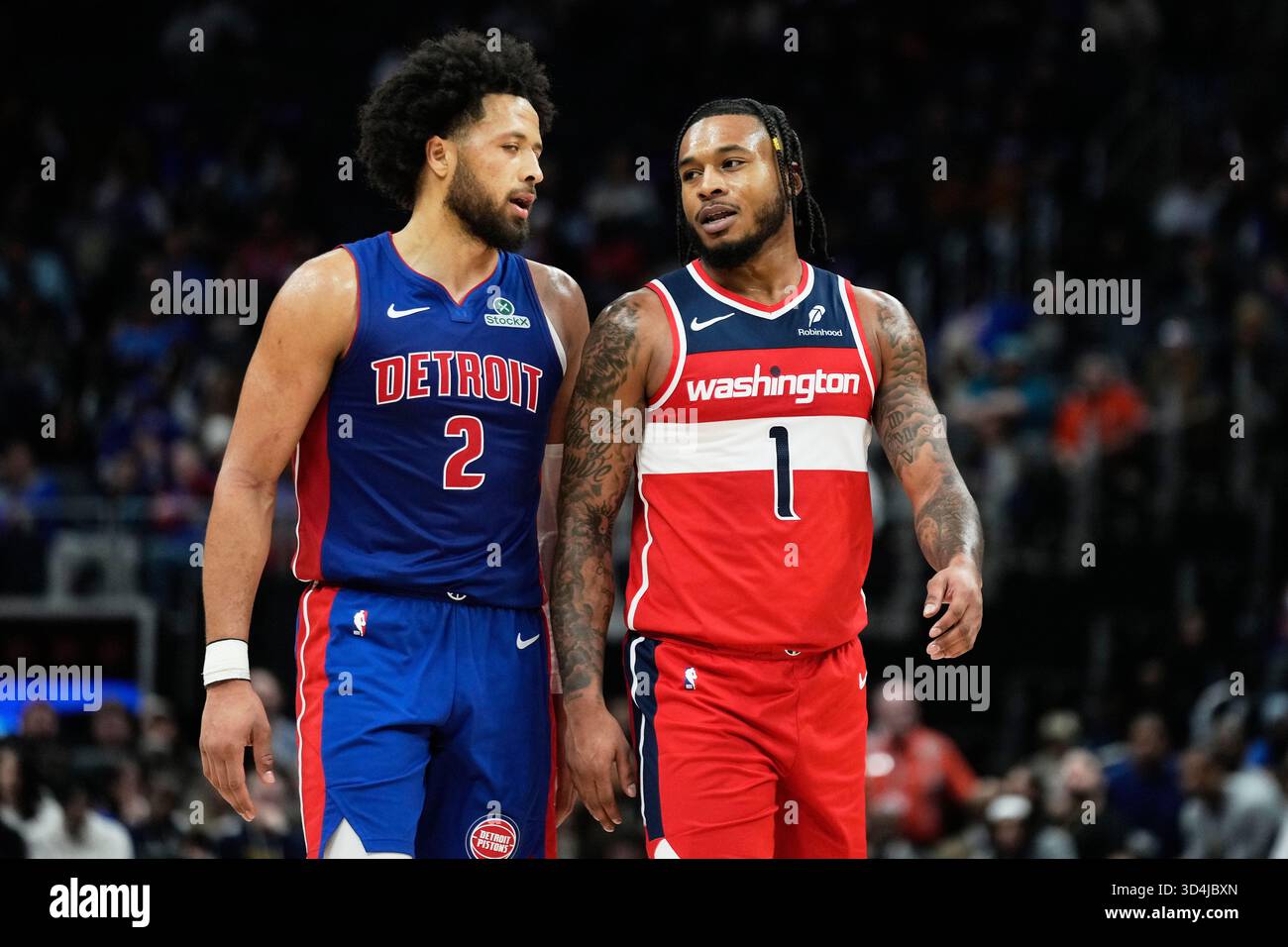 Detroit Pistons guard Cade Cunningham, left, speaks with Washington ...