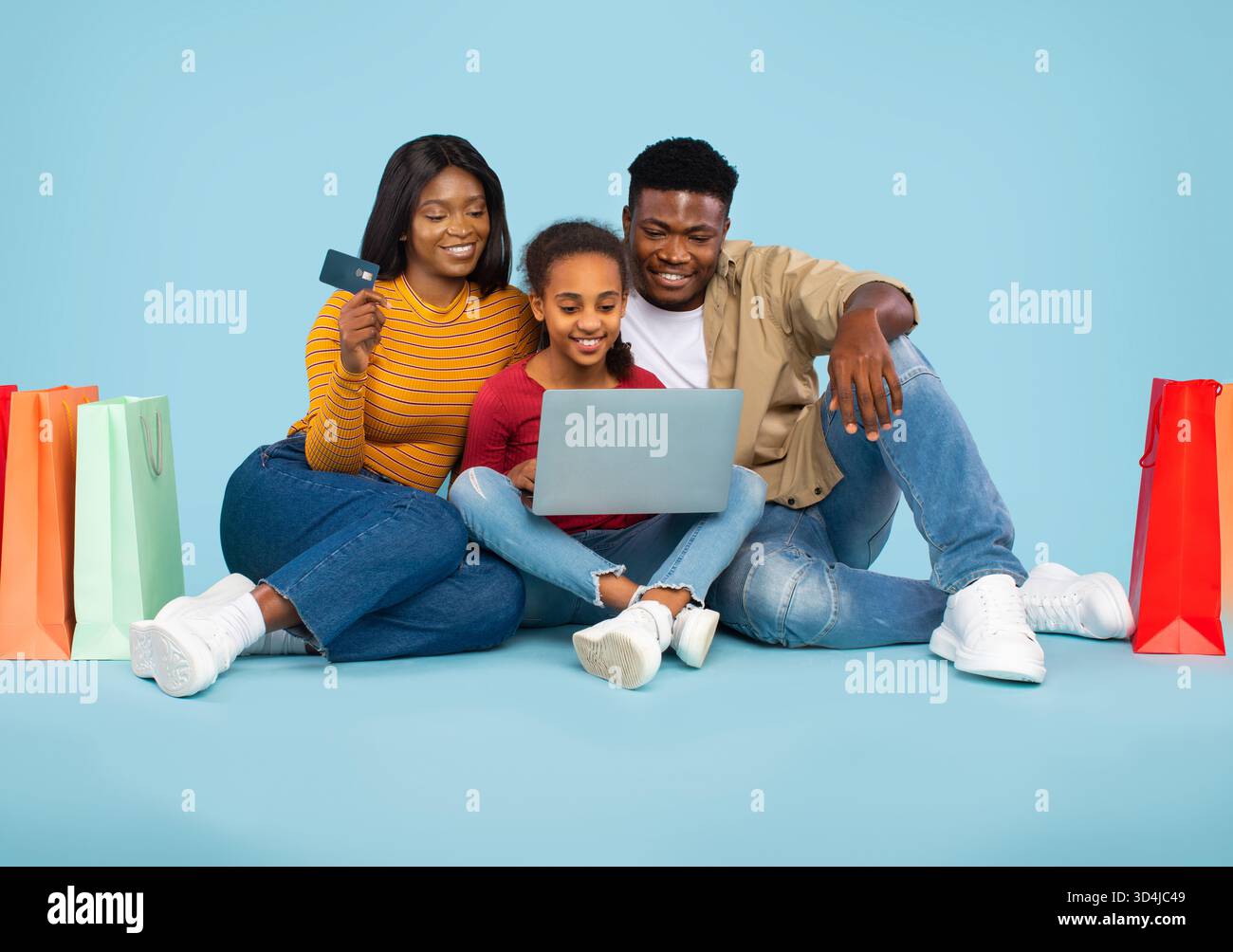 Family Enjoys Online Shopping Together During the Afternoon at Home ...