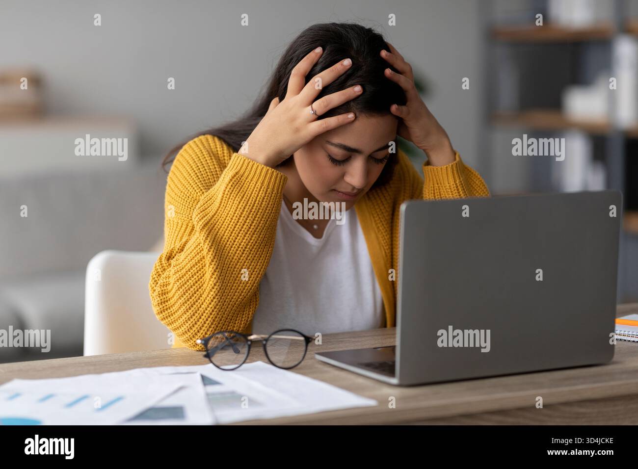 Stressed Arab Woman Working on Laptop at Home Dealing With Work-Related ...