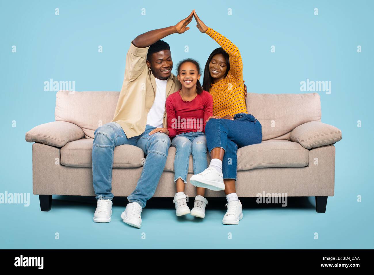 Family Enjoying Playful Time Together on a Cozy Sofa in a Bright Room ...