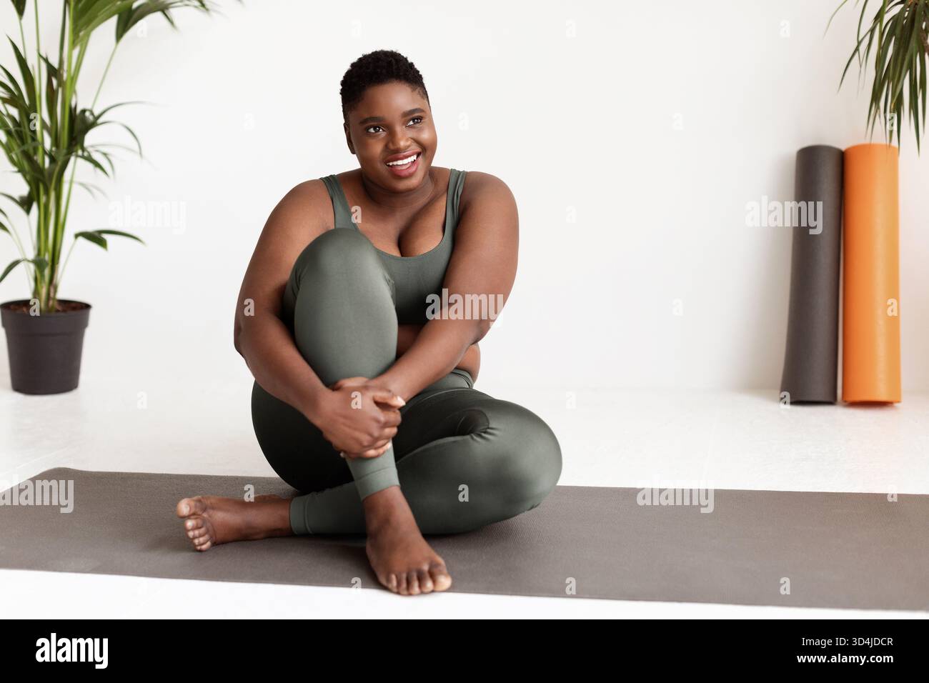 Positive Plus Size Lady Enjoying Yoga Session on Fitness Mat in Bright ...