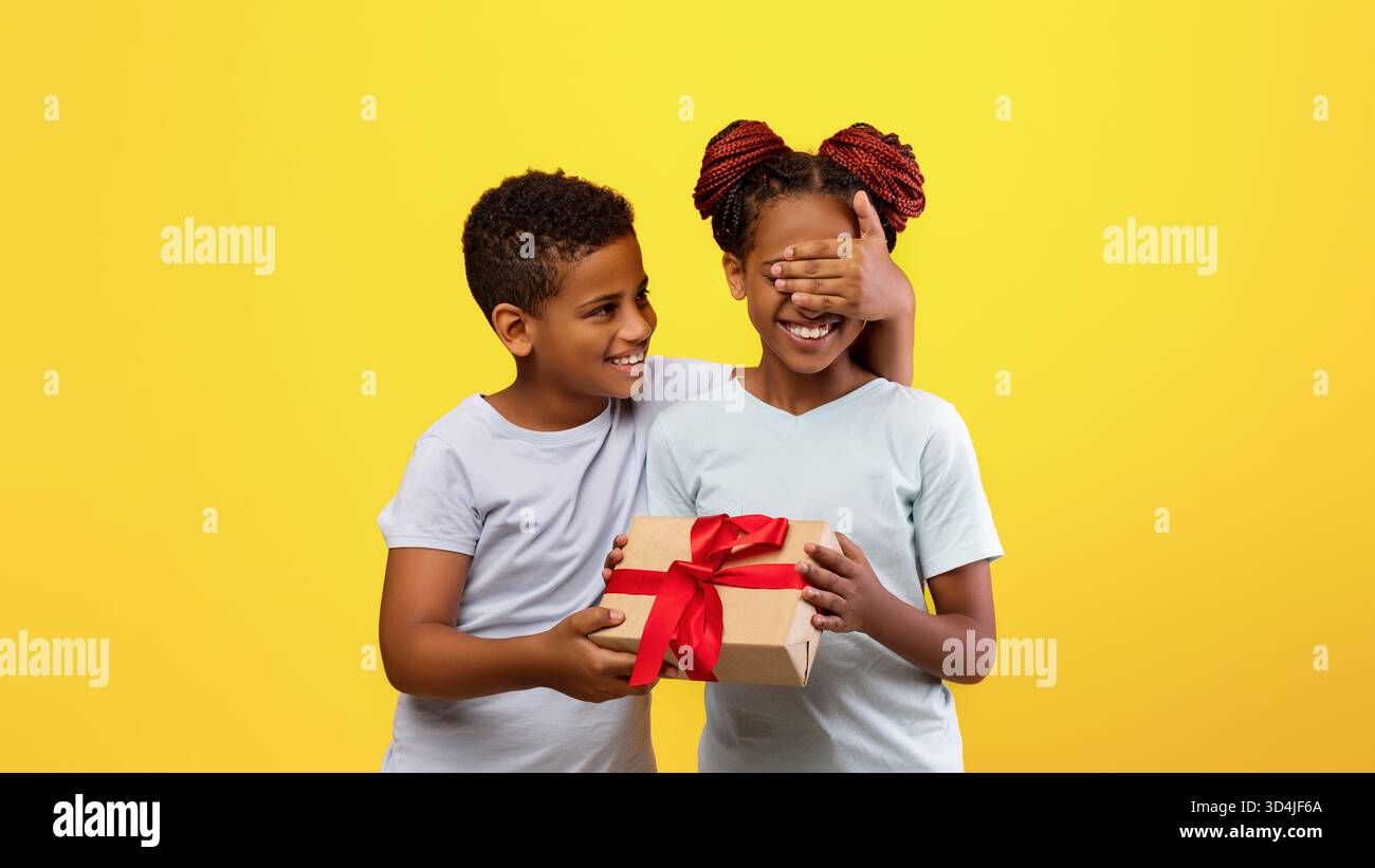Two Children Share a Joyful Moment While Preparing to Celebrate a ...