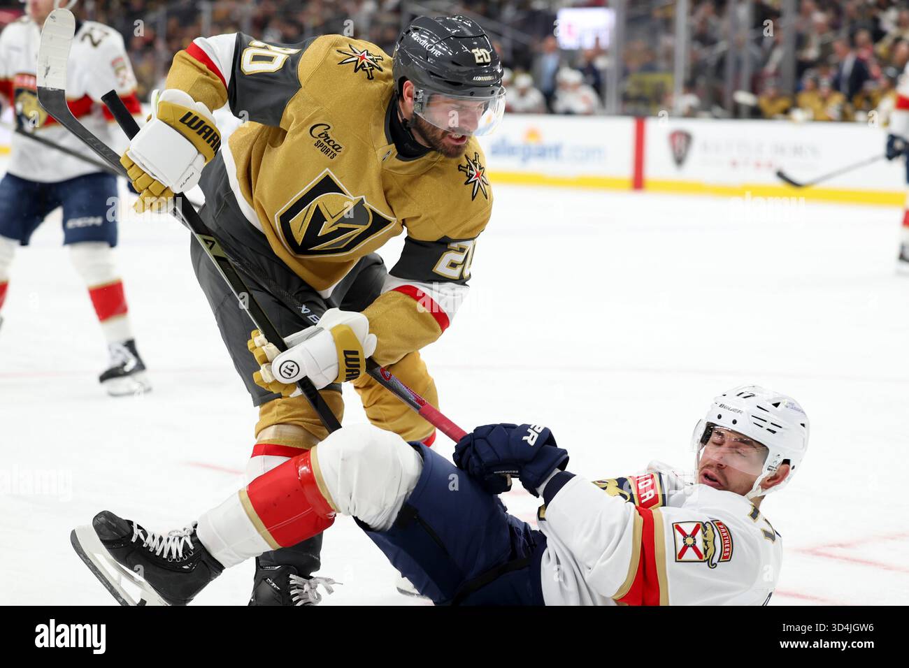 Vegas Golden Knights left wing Brandon Saad (20) checks Florida ...