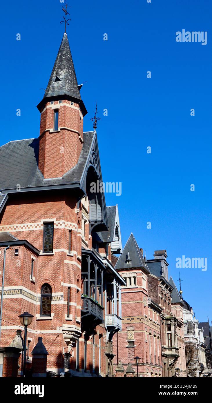Historic eclectic townhouses in Antwerp, featuring intricate red brick ...