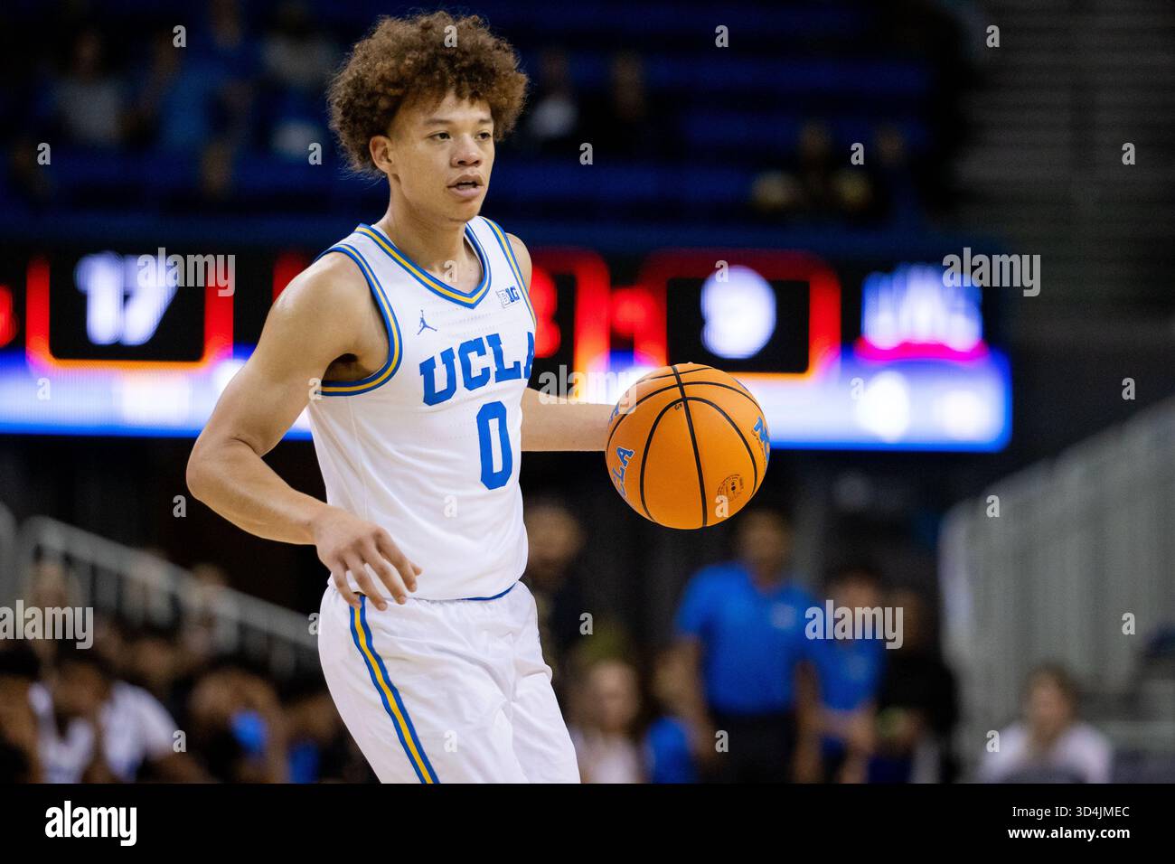 UCLA guard Trent Perry (0) dribbles the ball during the first half of ...