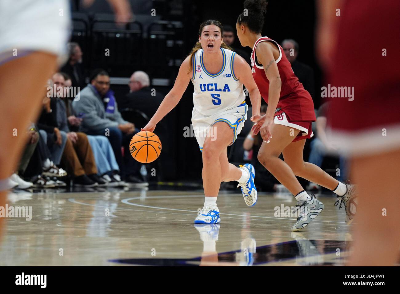 UCLA guard Charlisse Leger-Walker (5) dribbles during the second half ...