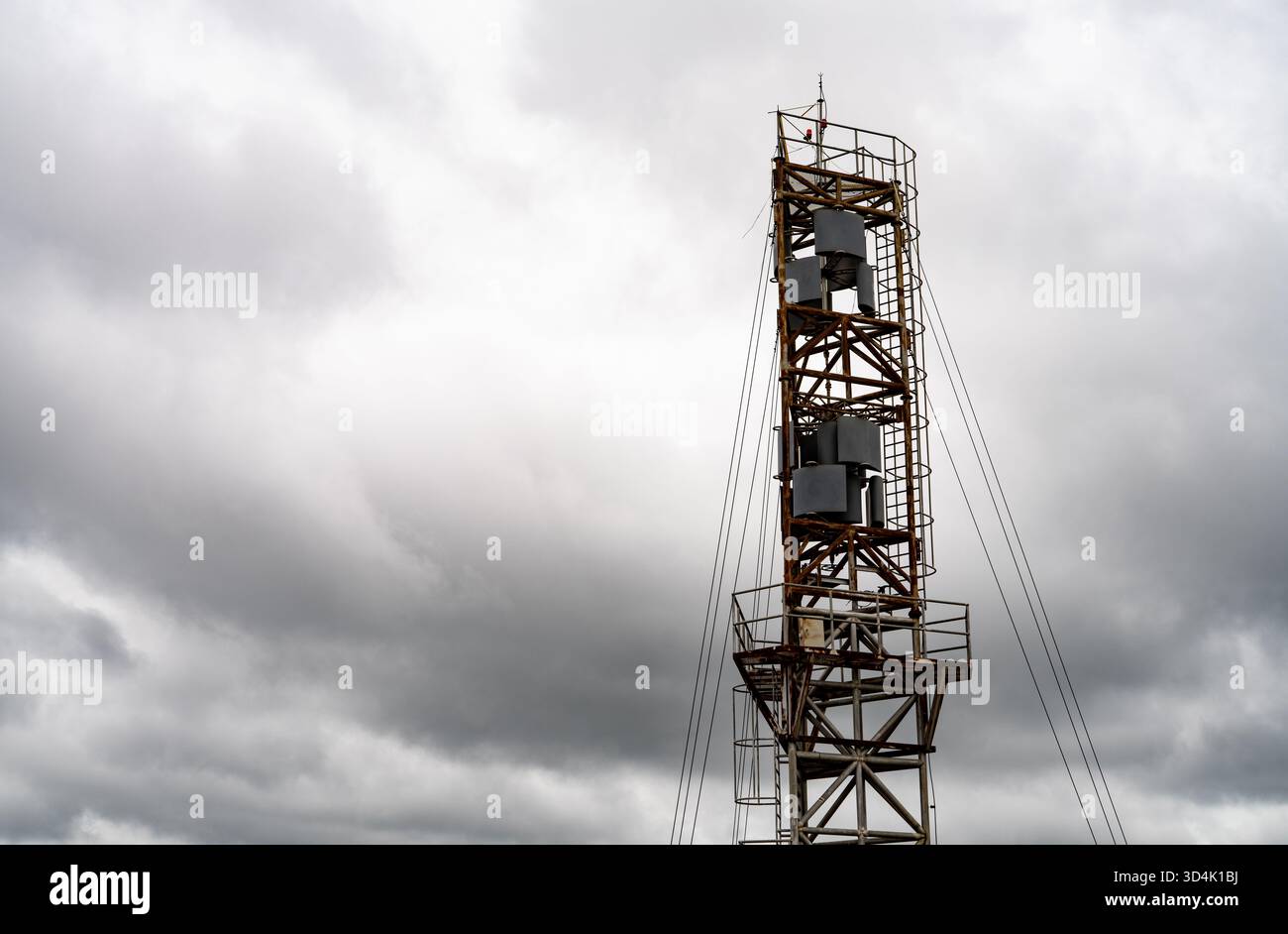 Steel wind measurement tower with mounted sensors standing beside ...