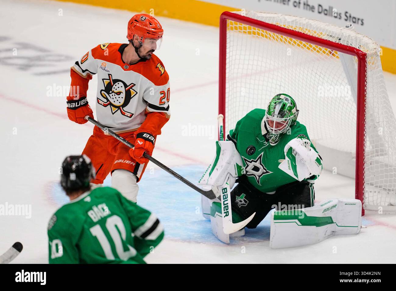 Dallas Stars goaltender Jake Oettinger (29) gloves a re-directed shot ...