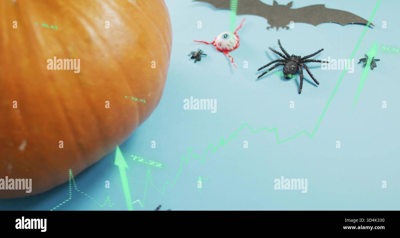 Sitting large orange pumpkin on pale blue table, showing spiders ...