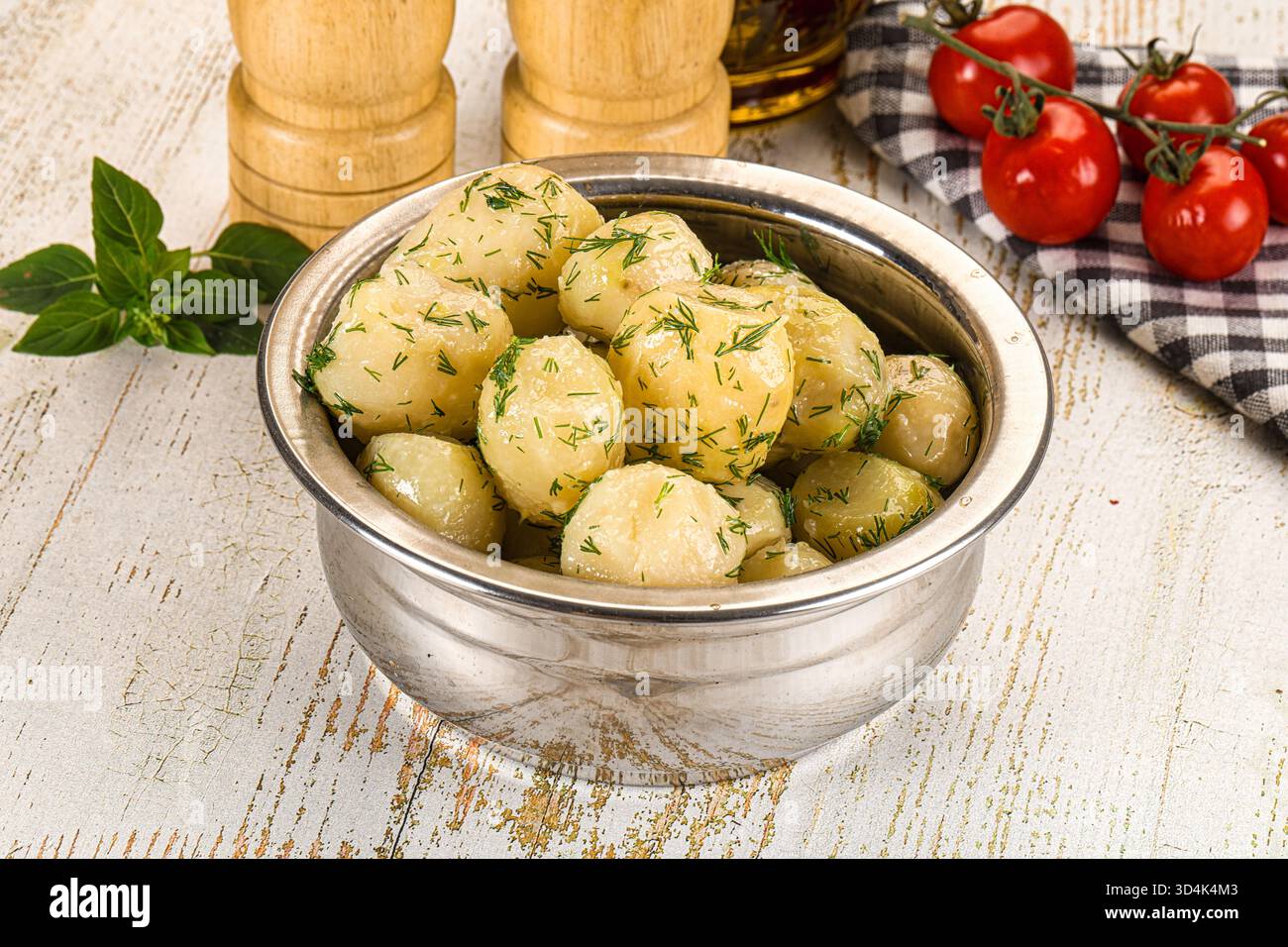 Young boiled mini potato with dill and butter Stock Photo - Alamy