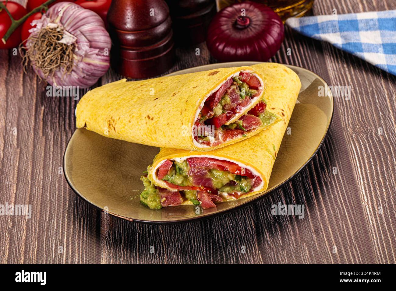 Burrito with tuna and vegetables wrap roll Stock Photo - Alamy