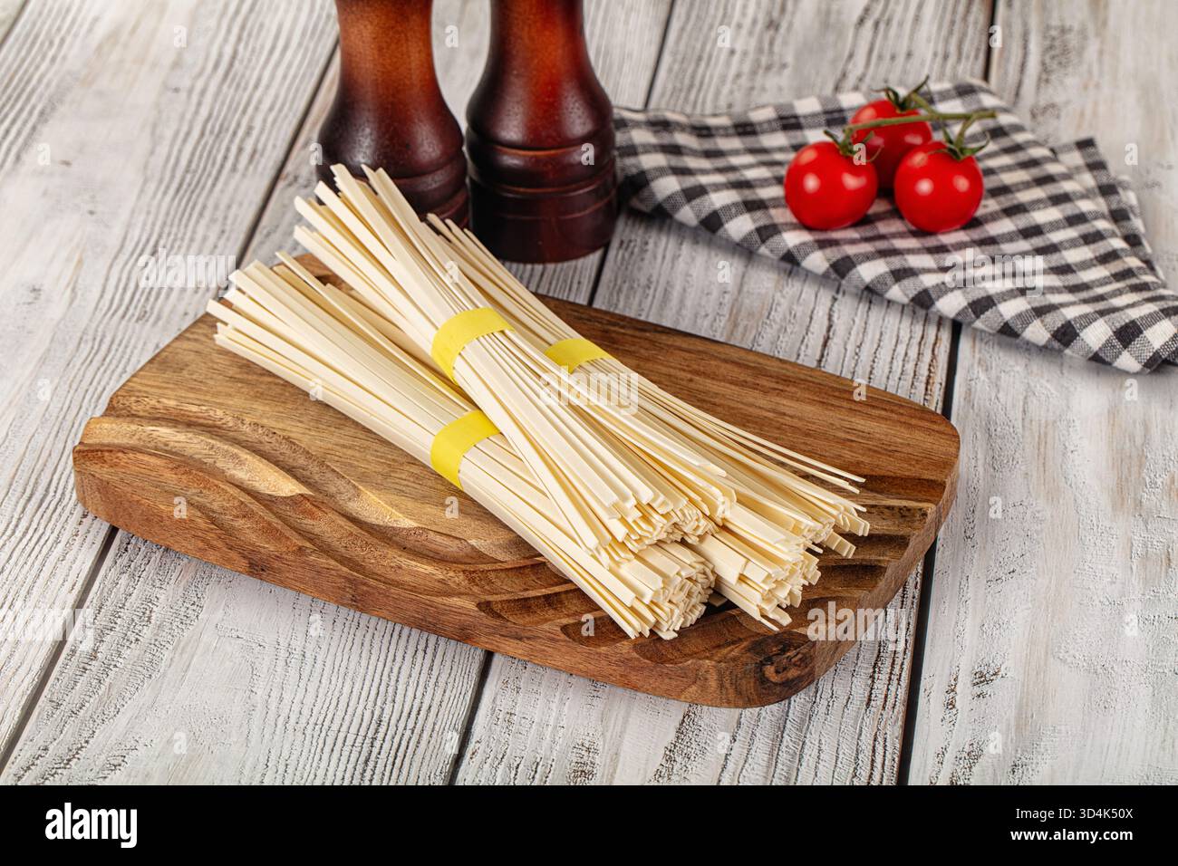 Raw dry wheat udon noodles for cooking Stock Photo - Alamy