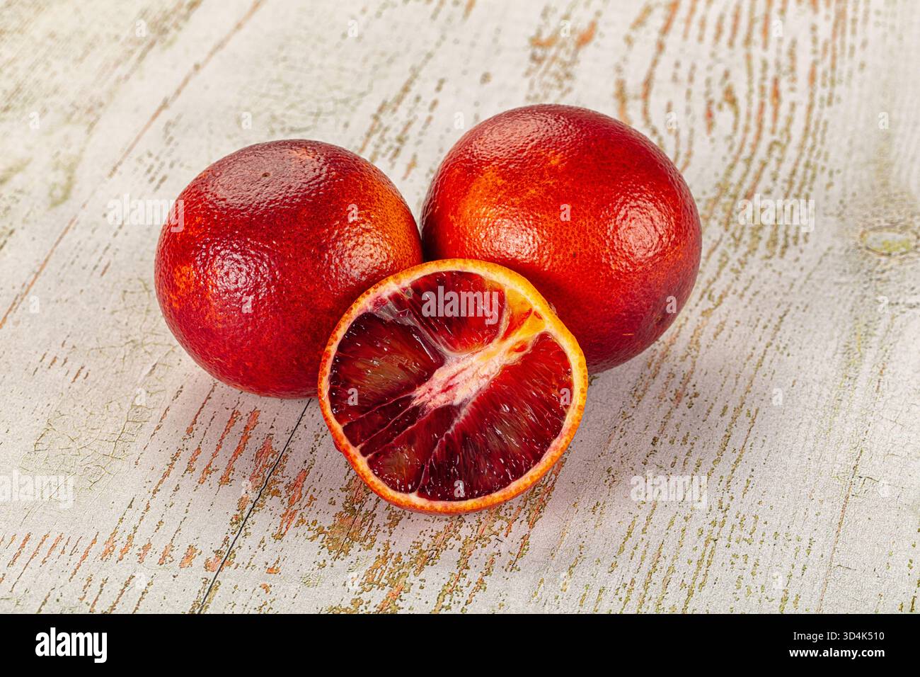 Red sweet juicy orange fruit with half slice Stock Photo - Alamy