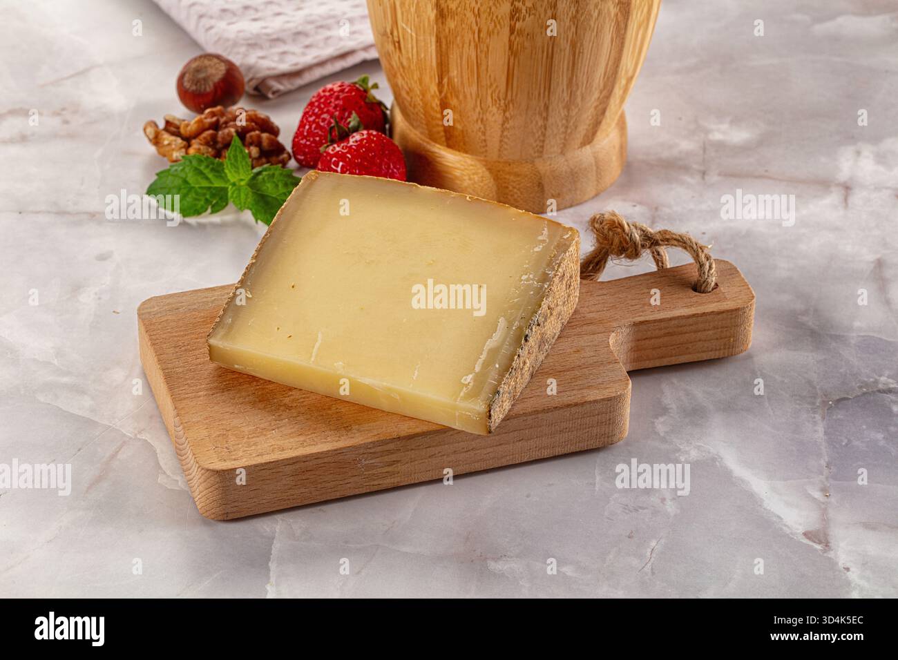 Gourmet hard aged yellow cheese piece Stock Photo - Alamy