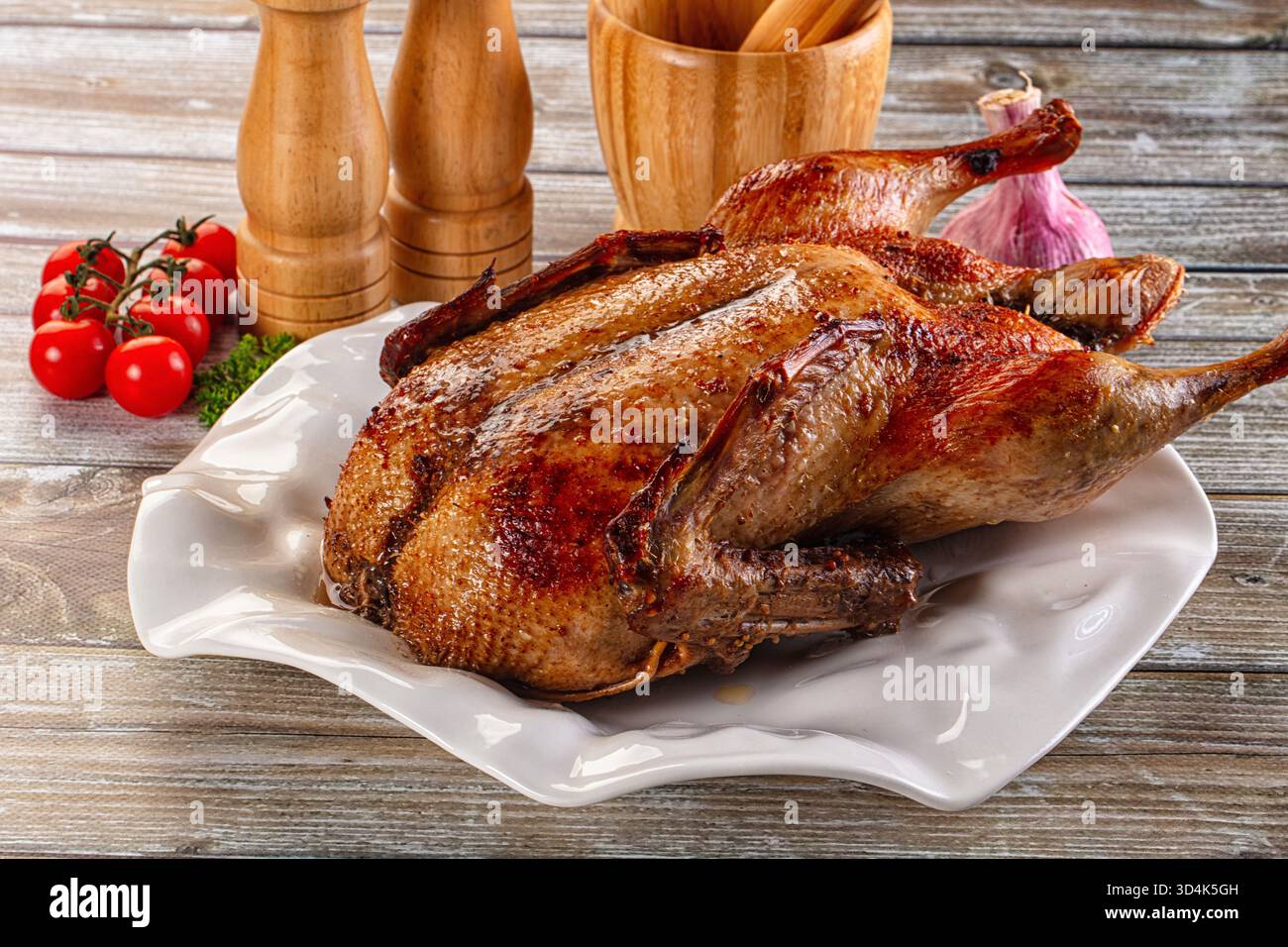 Baked with spices whole duck for celebrating Stock Photo - Alamy