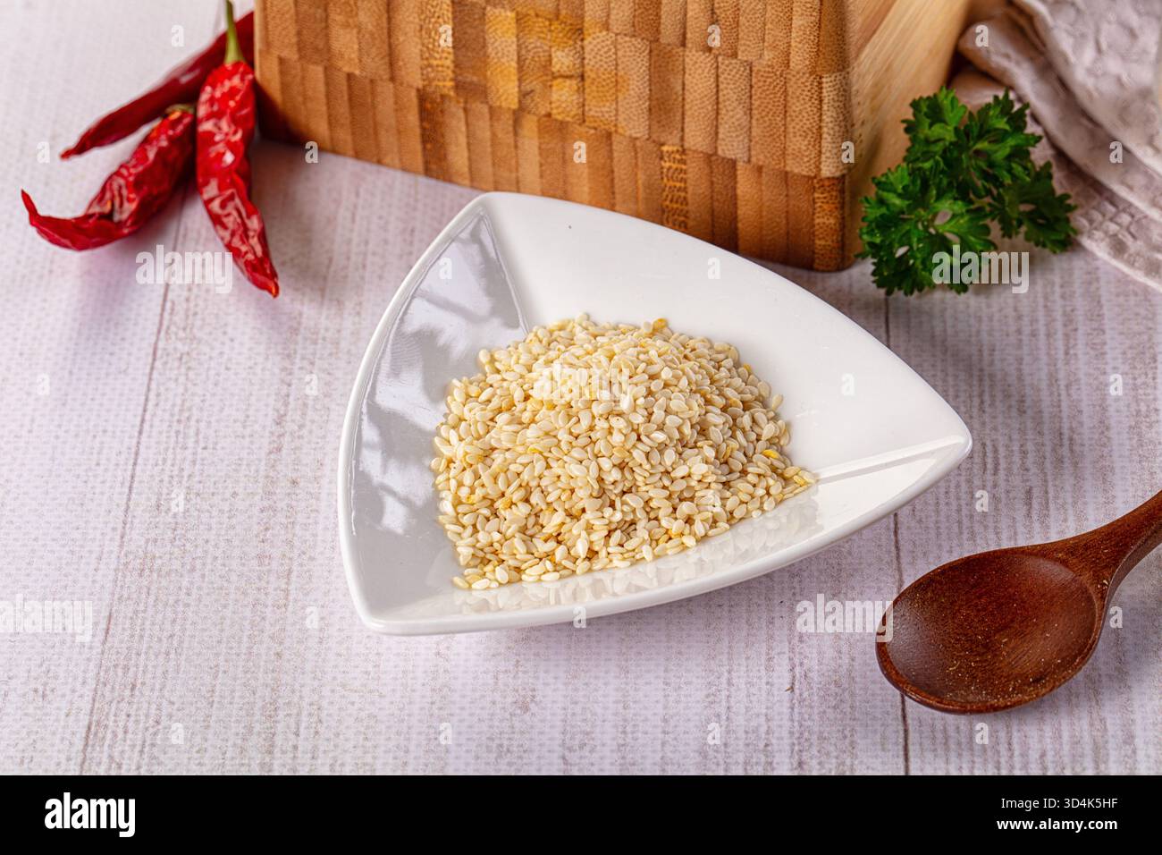 Raw dry sesame seeds heap in the bowl Stock Photo - Alamy
