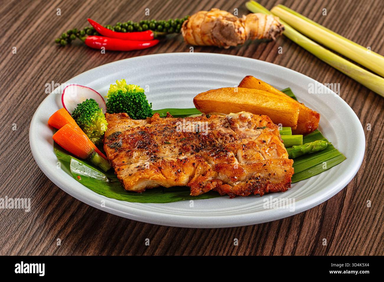 Gourmet asian Grilled crocodile steak served potato and asparagus Stock ...