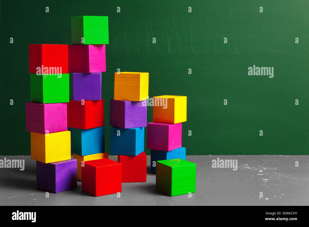 Colorful wooden blocks stacked in various arrangements in a classroom ...