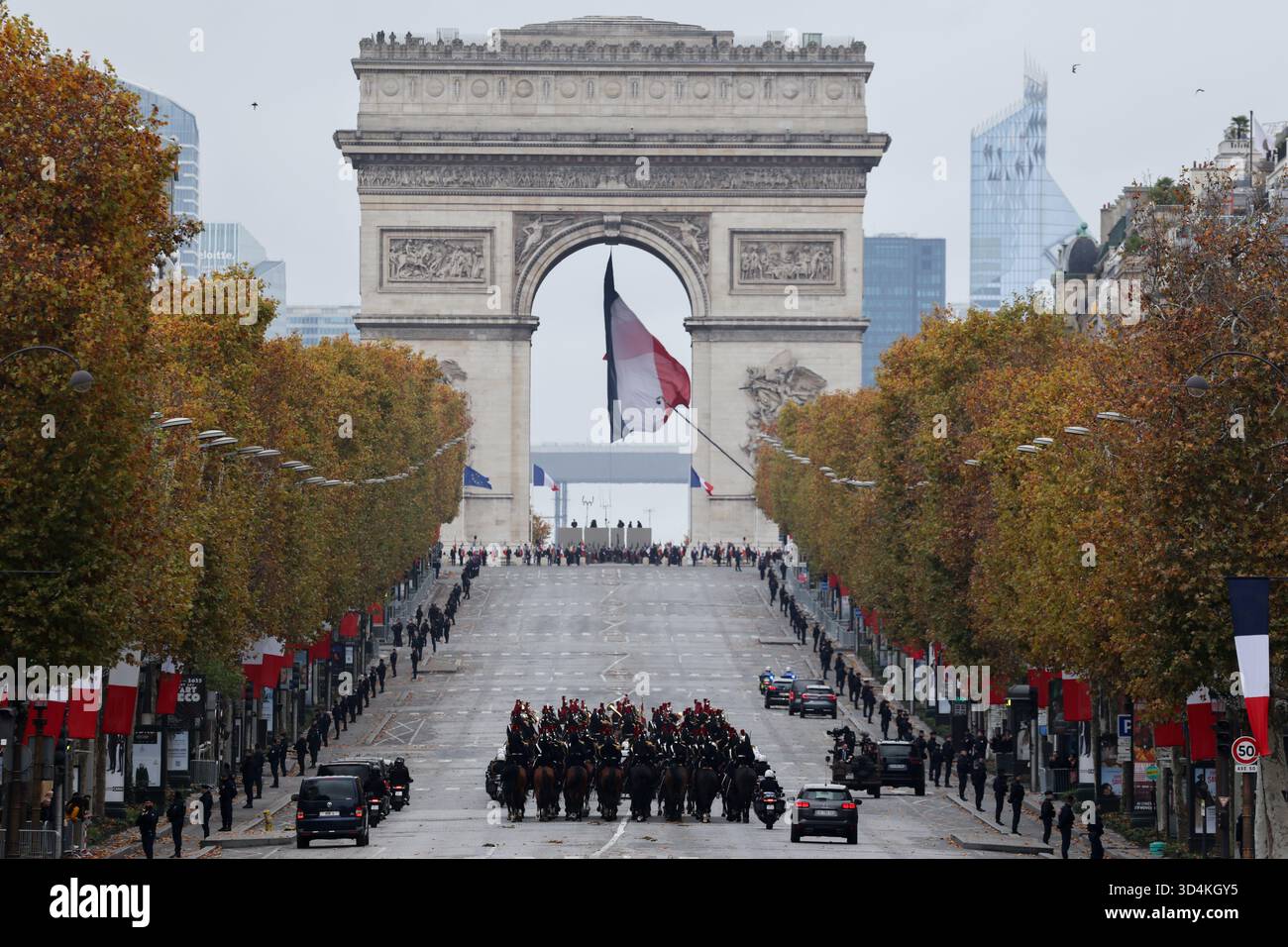 Republican Guards ride up on the Champs-Elysees avenue in Paris ...