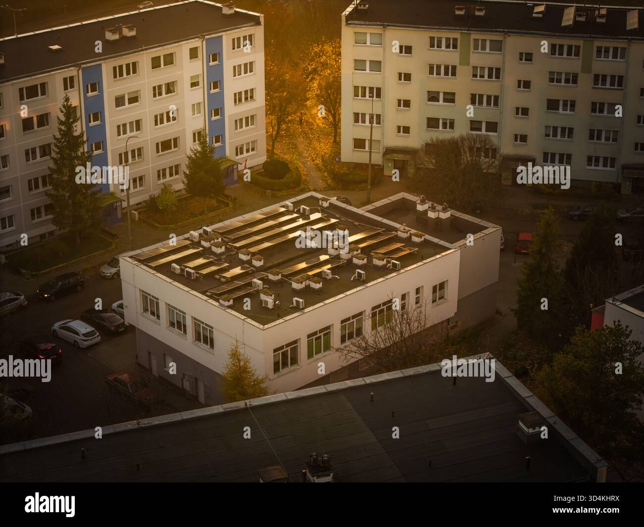 Aerial view of a compact building with multiple roof-mounted units ...