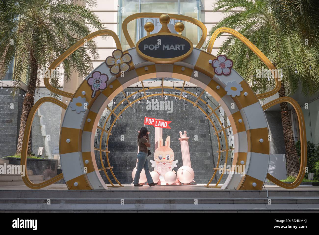 A girl passes by the archway of Pop Land during the Pop Land Exclusive ...