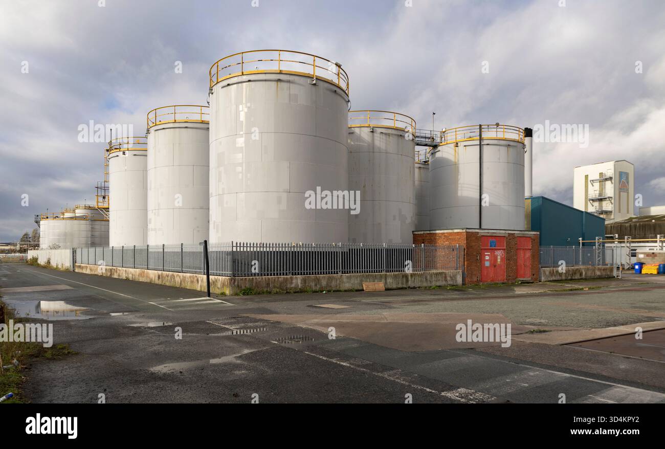 Industrial Storage Tanks Complex With Large White Silos, Fenced Yard ...