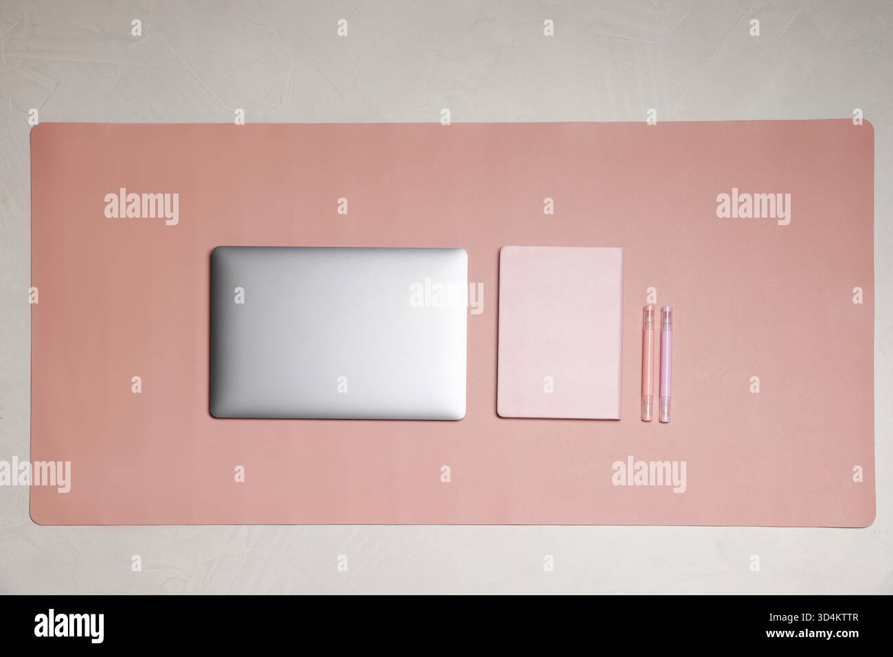 Laptop, notebook, pens and pink mat on light grey table, flat lay Stock ...