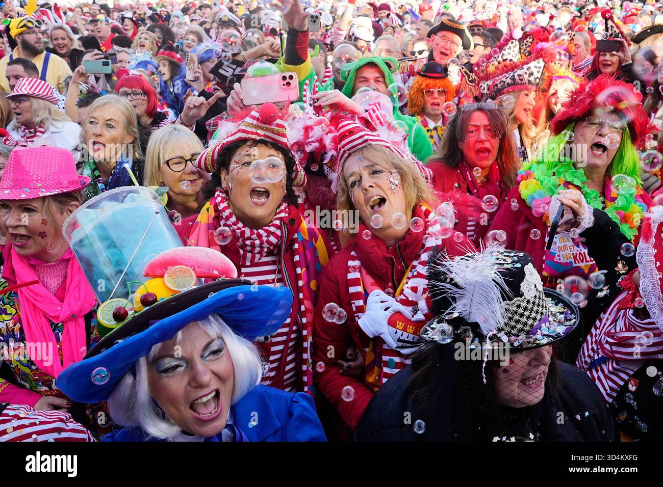 Costumed revelers celebrate in the central Heumarkt in Cologne, Germany ...