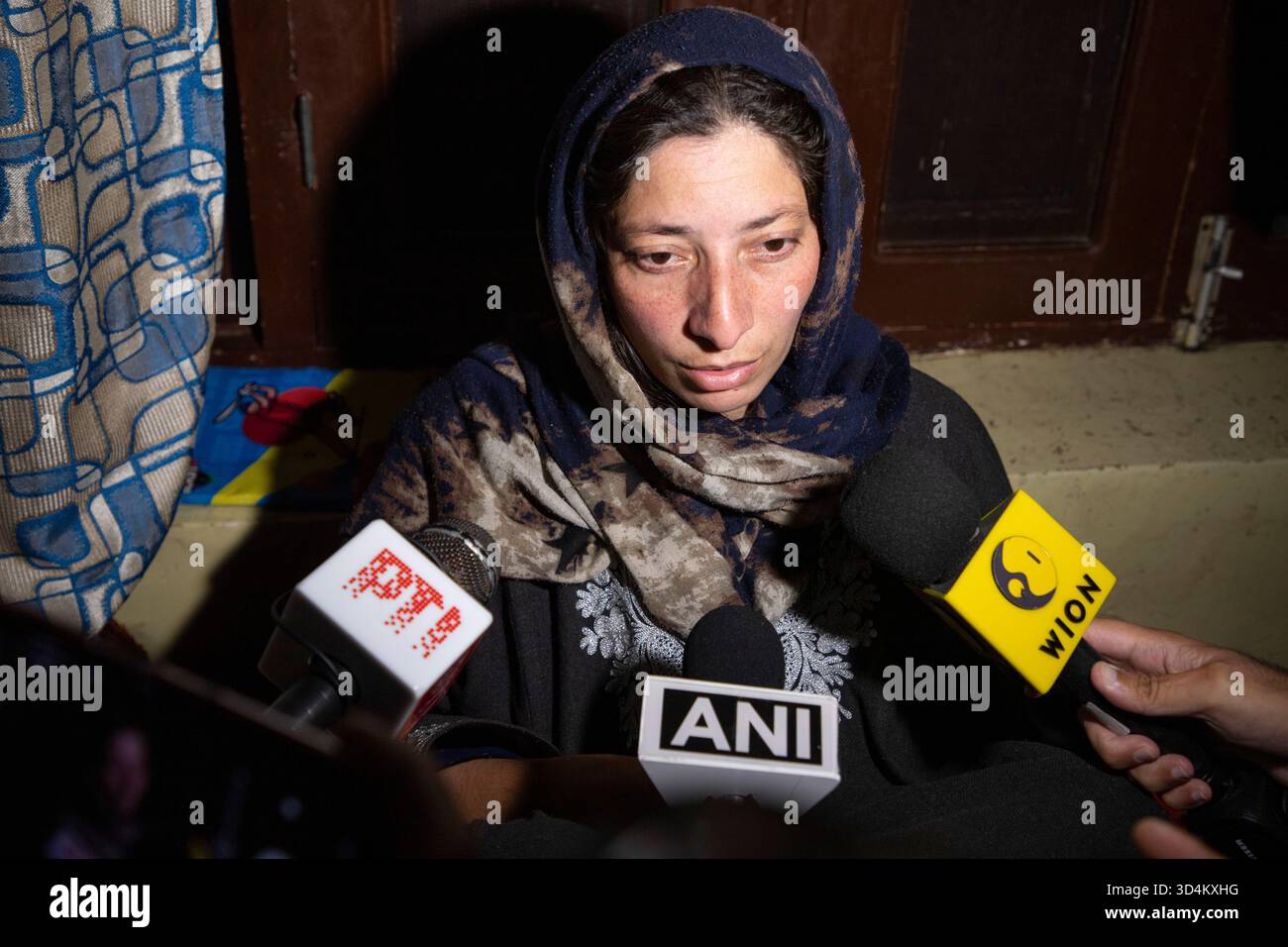 Sister-in-law of Kashmiri doctor Mohammad Umar speaks to media at their home. A car explosion ...