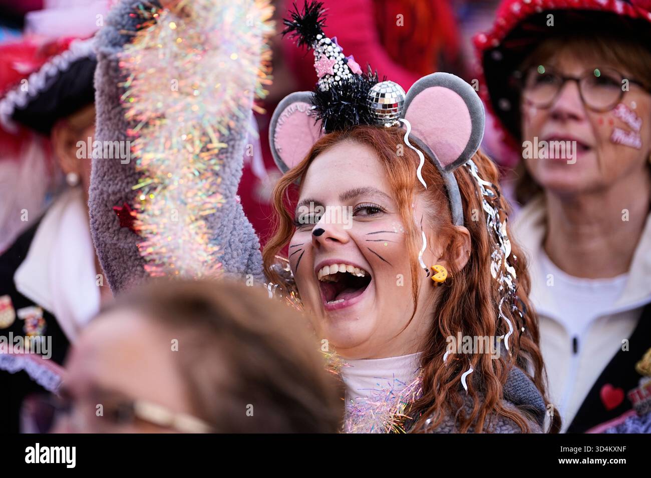 Costumed revelers celebrate in the central Heumarkt in Cologne, Germany ...