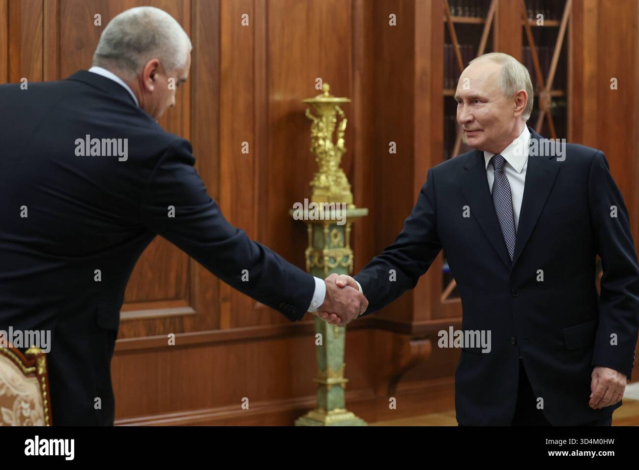 Russian President Vladimir Putin, right, shakes hands with the Crimean ...