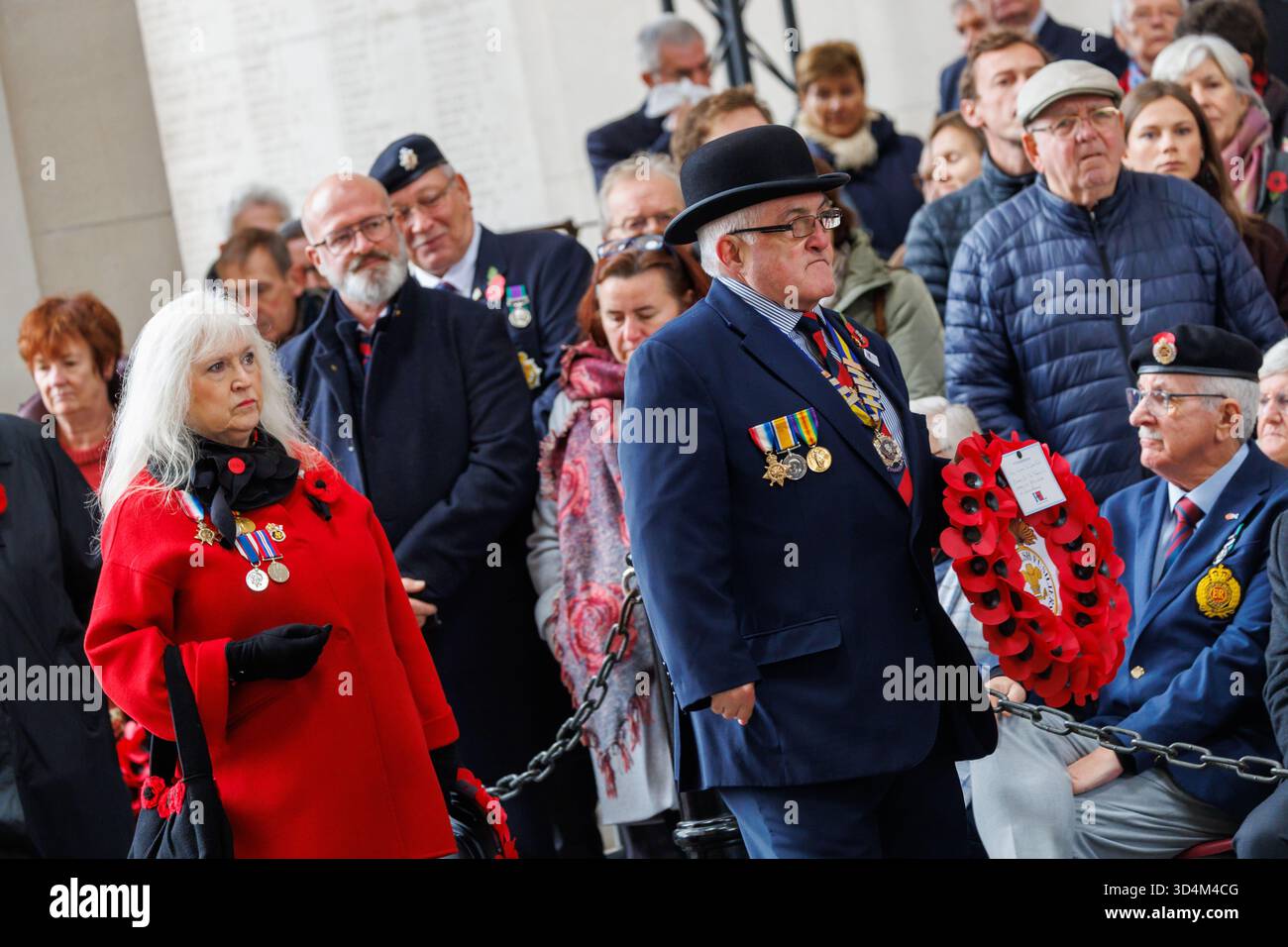 British citizens carrying poppy wreaths during the 'Poppy Parade' walk ...