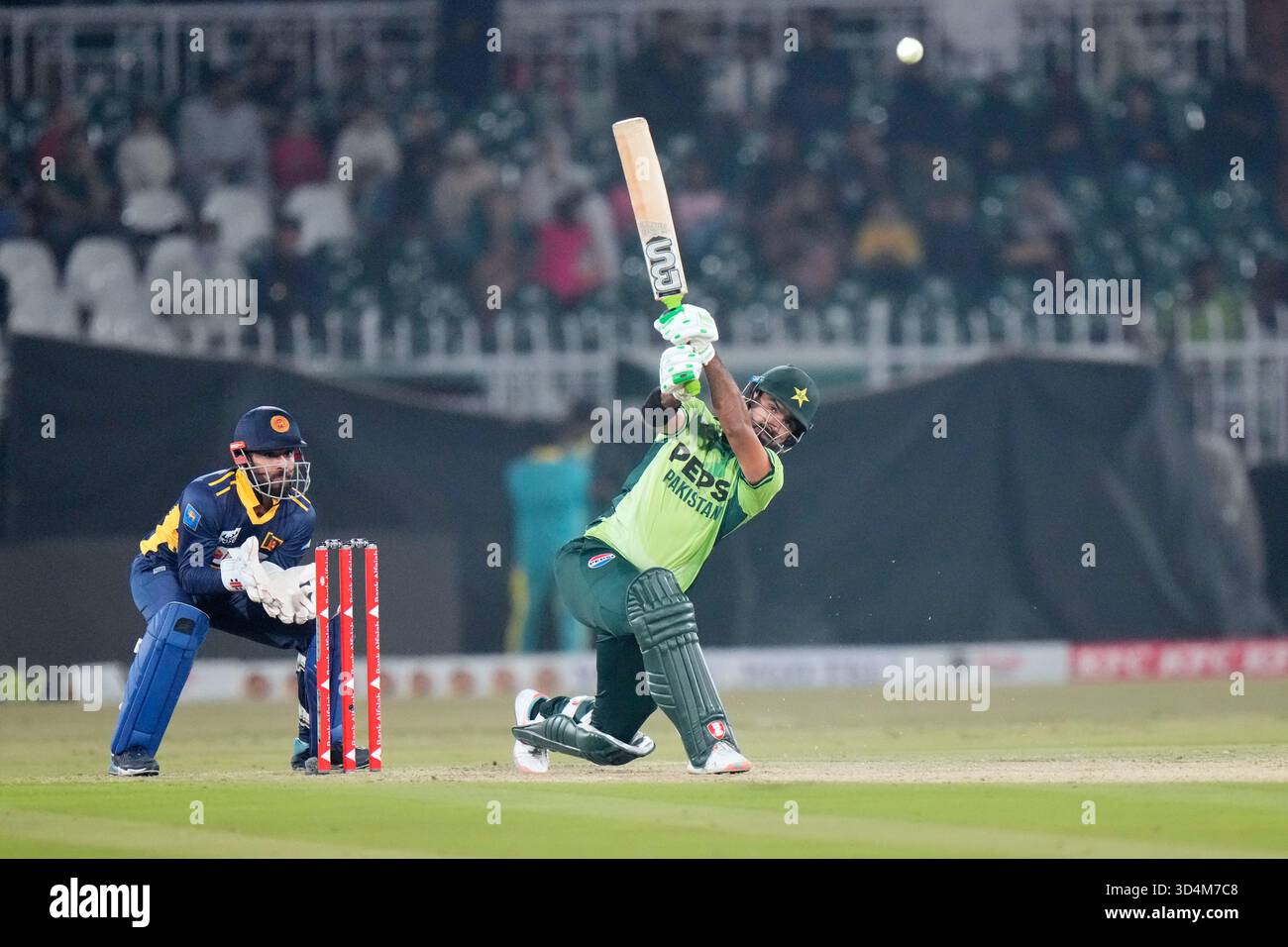 Pakistan's Hussain Talat, right, plays a shot as Sri Lanka's Kusal ...