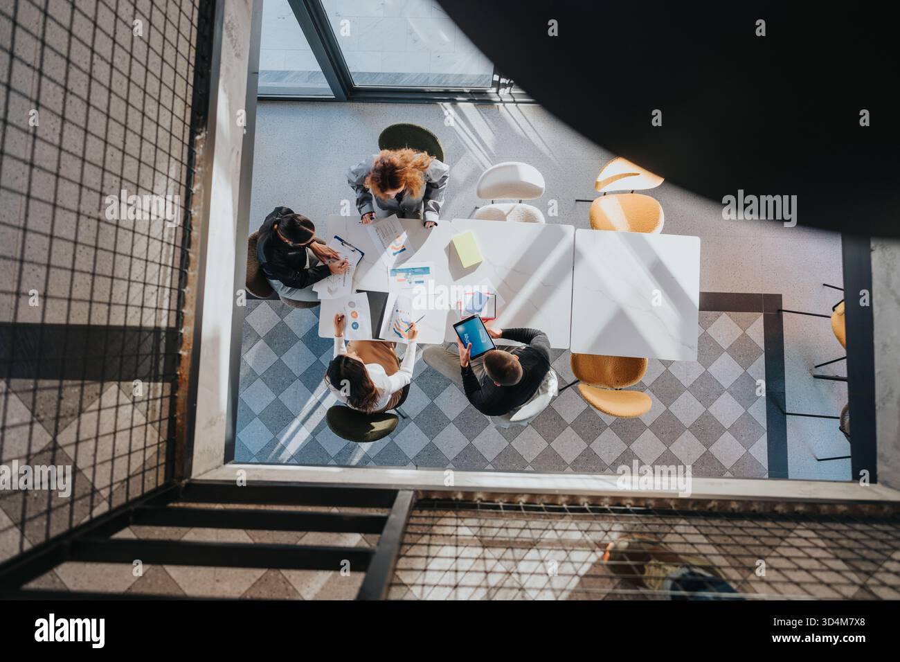 Top-Down View of a Collaborative Business Meeting With Documents ...
