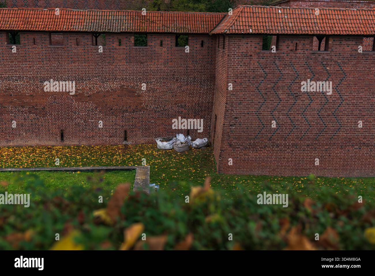 Red brick wall and corner tower of Malbork Castle in Malbork, Poland ...