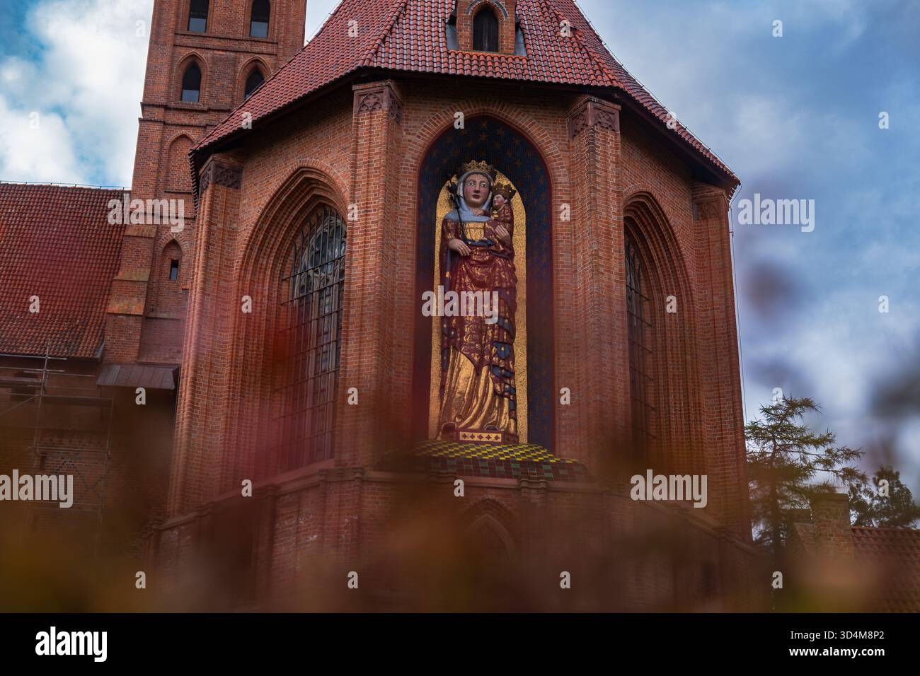 Close up of Malbork Castle facade shows a Madonna and Child niche ...