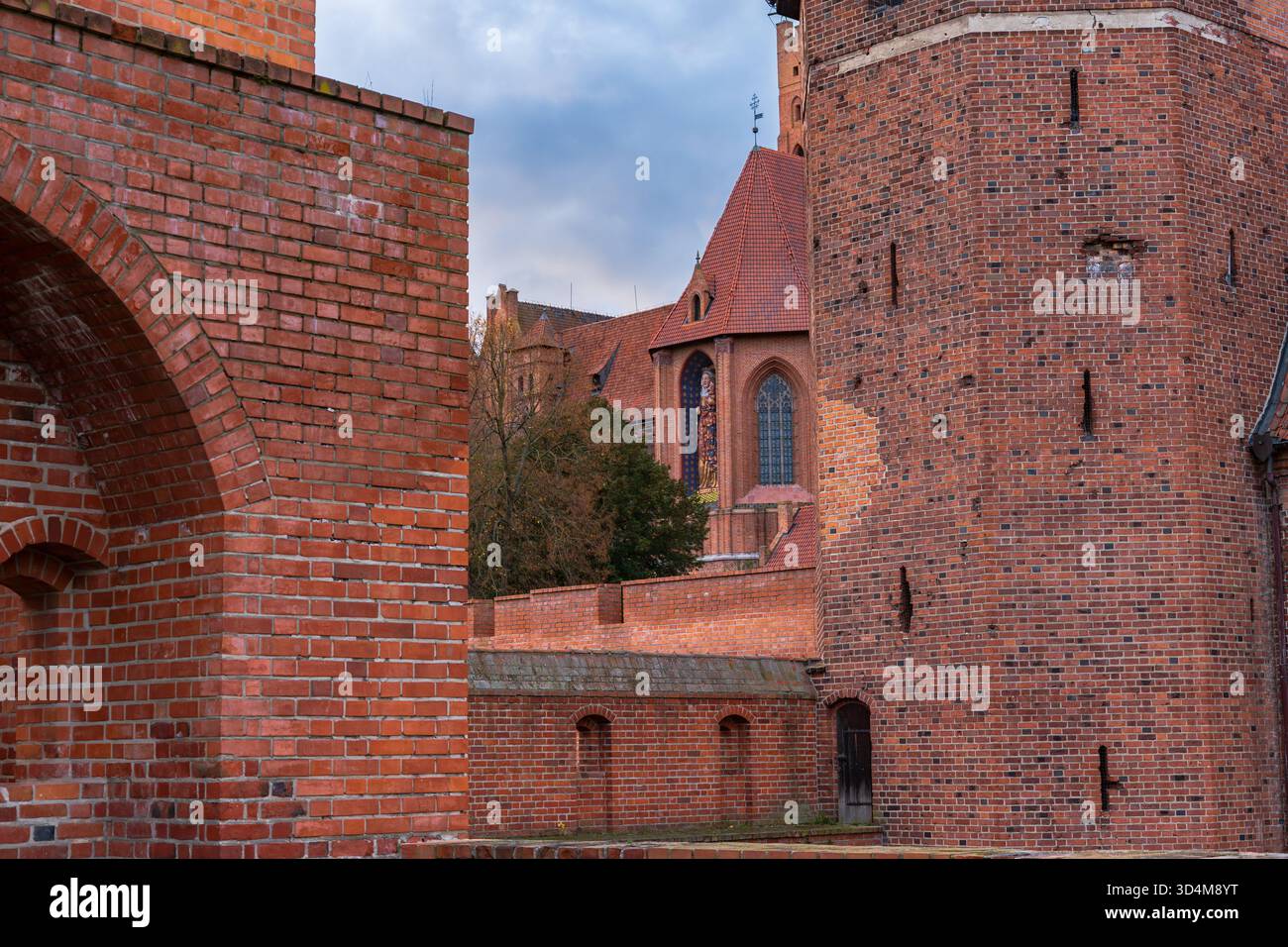 Close view of Malbork Castle in Malbork, Poland shows red brick walls ...