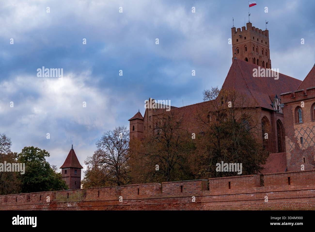 Malbork Castle in northern Poland shows red brick walls, a square keep ...