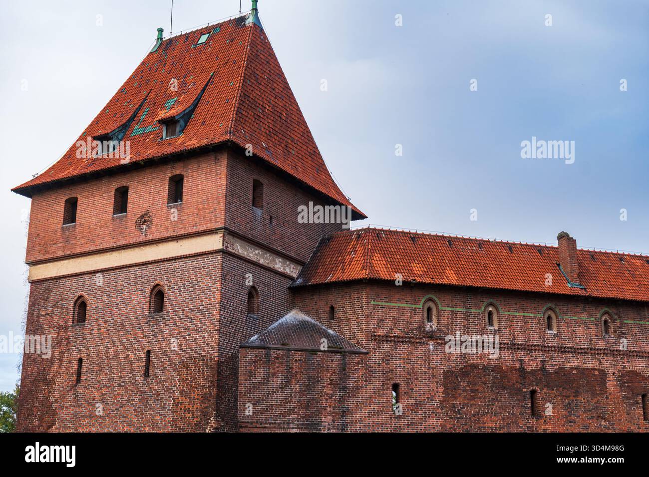 Close up of Malbork Castle in Malbork, Poland shows a red brick tower ...