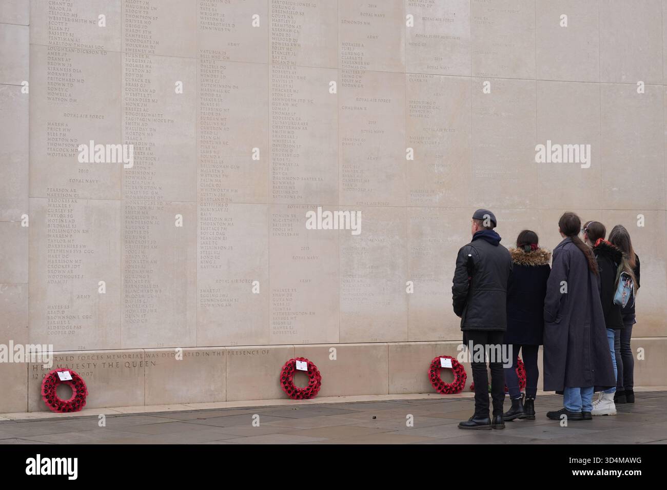 Visitors view the Armed Forces Memorial at the National Memorial ...