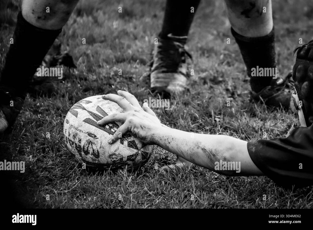 Images of rugby players kicking a ball and scoring a try on an outdoor ...